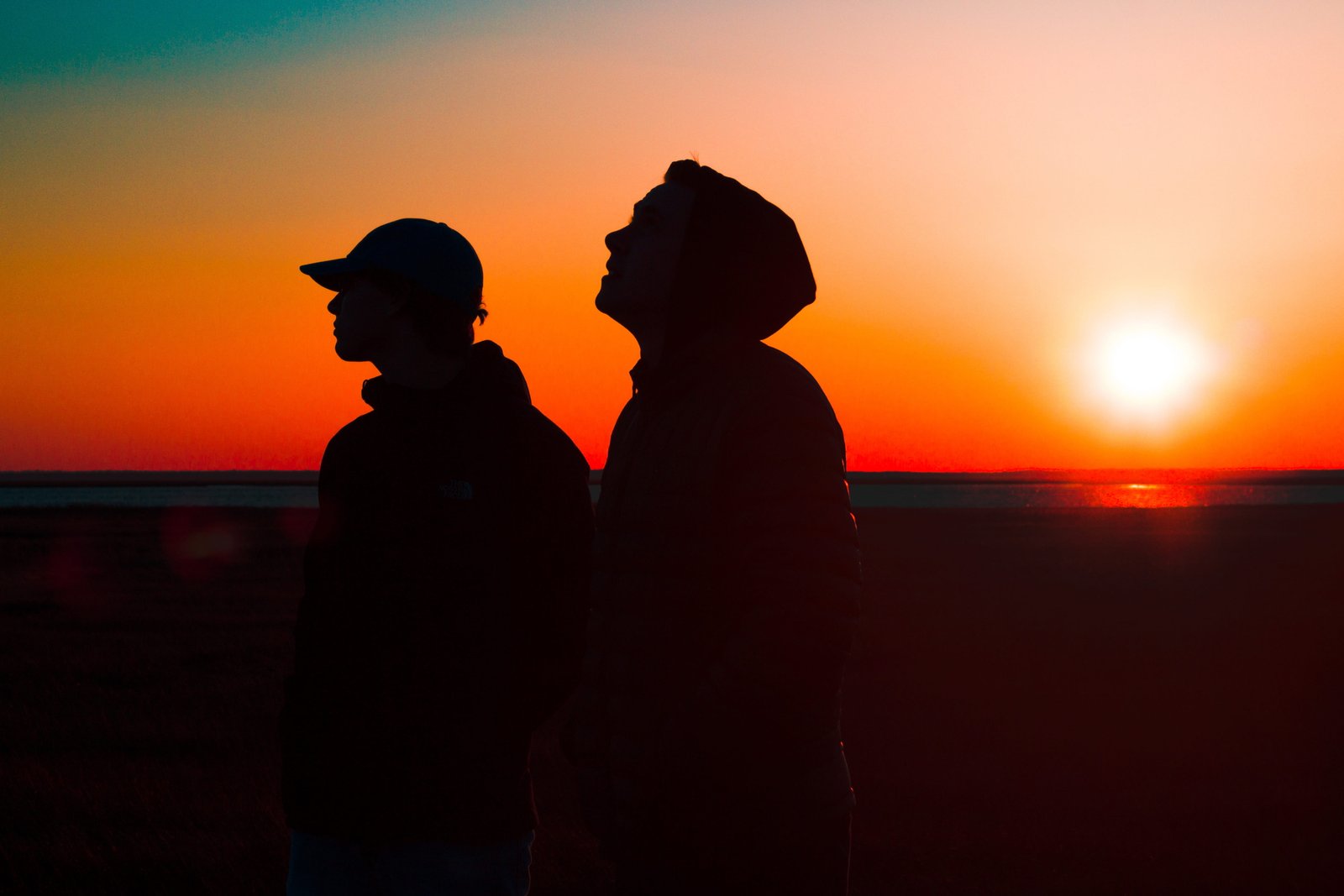 Silhouettes of two men at sunset people friends nature summer 2k 4k 5k ...