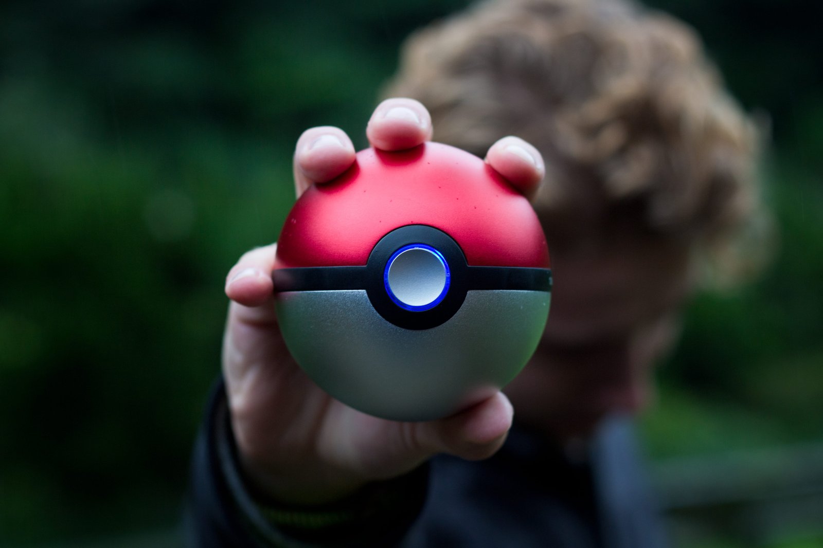 Person Holding Pokemon Ball Toy macro pokeball human hand 2k 4k 5k ...